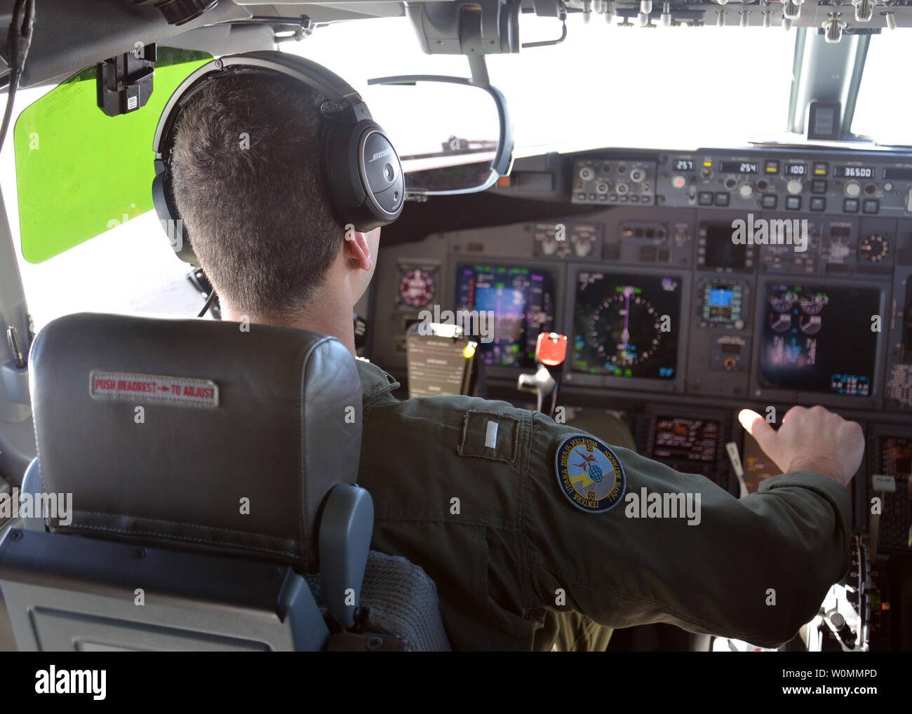 U.S. Naval aviator Lt. Kyle Atakturk pilots a P-8A Poseidon during a ...