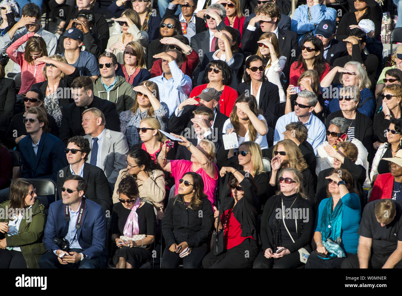 A crowd from the West Lawn watches a large screen showing Pope Francis ...