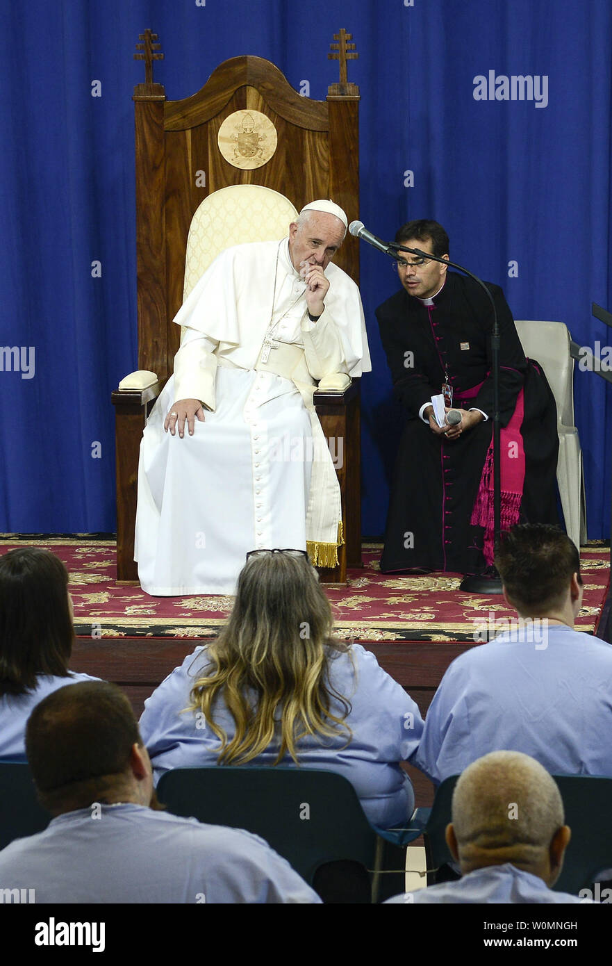 Pope Francis speaks with inmates and members of their families at ...