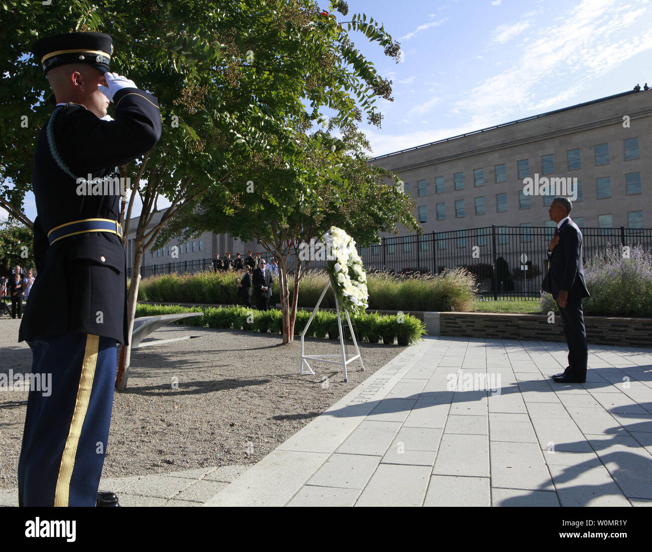 Prsident Barack Obama lays a wreath at the memorial observance ceremony ...