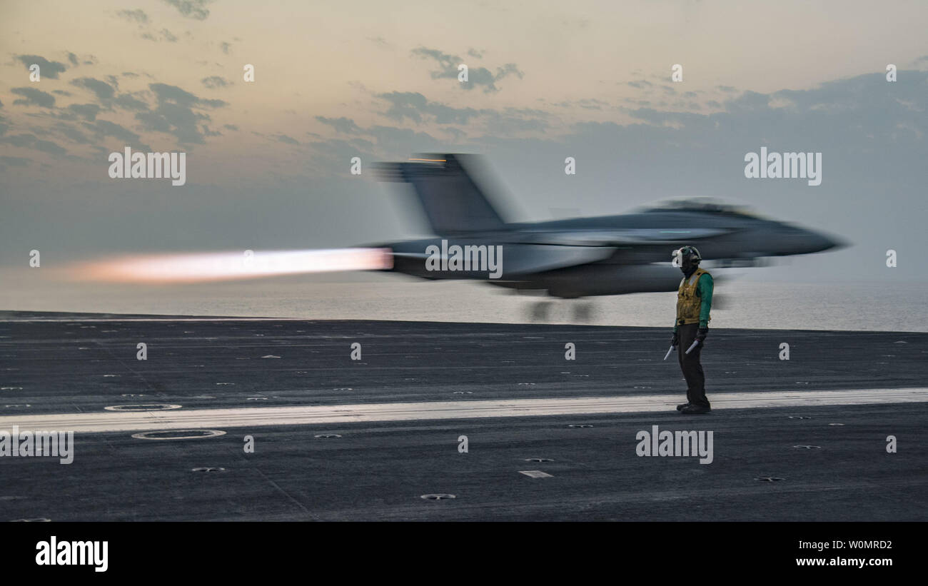 Petty Officer 3rd Class Quinton Carter, from Dallas, stands as a ...