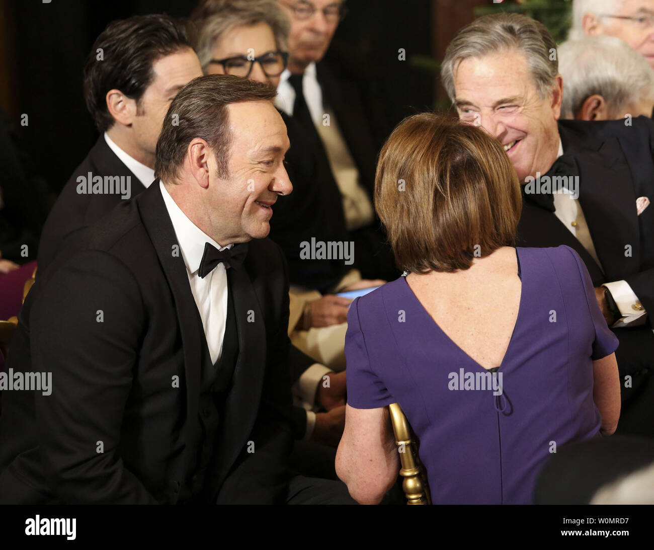 Actor Kevin Spacey (L) and representative Nancy Pelosi (R) wait for the ...