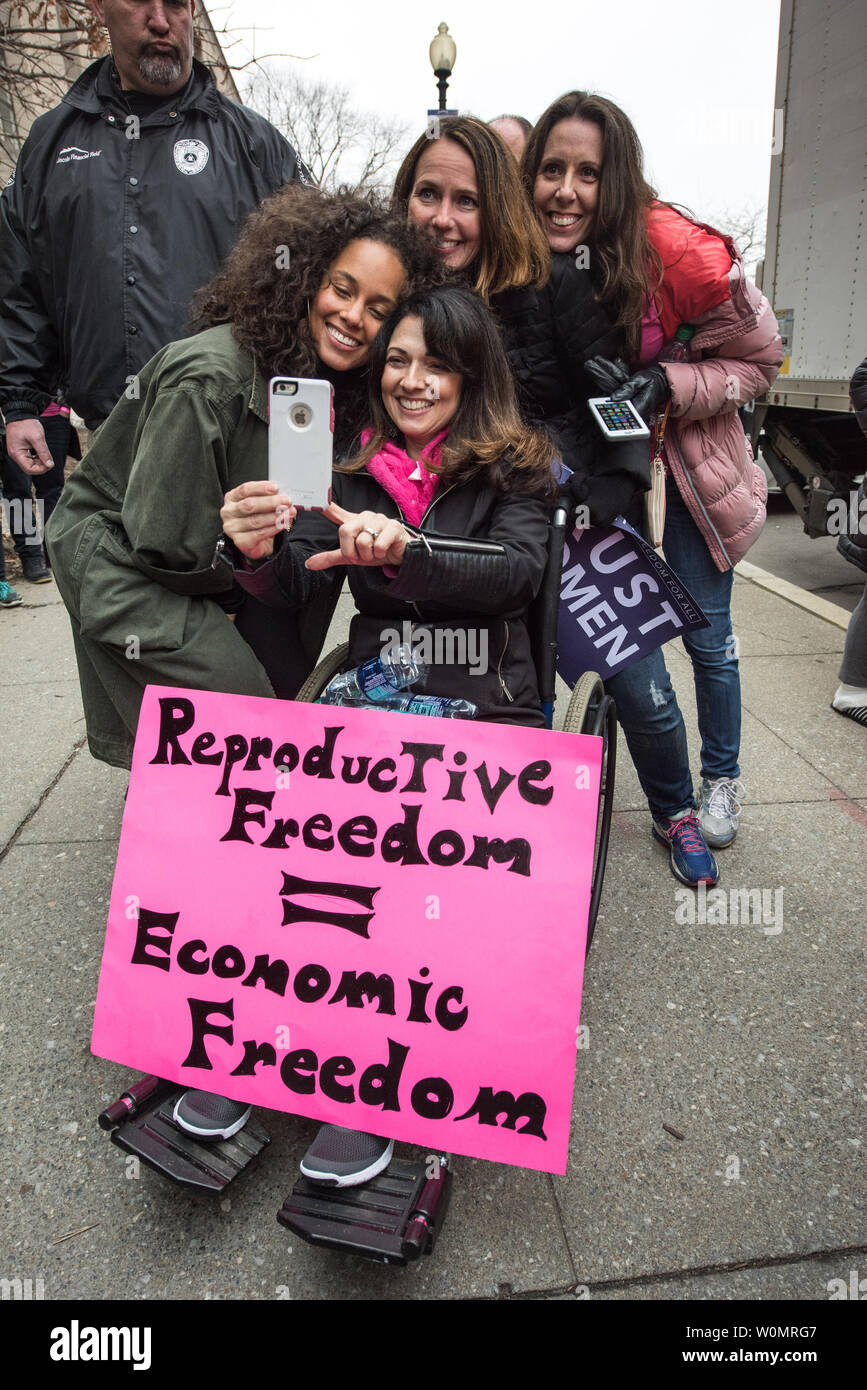 Alicia Keys takes a selfie with a woman as hundreds of thousands ...