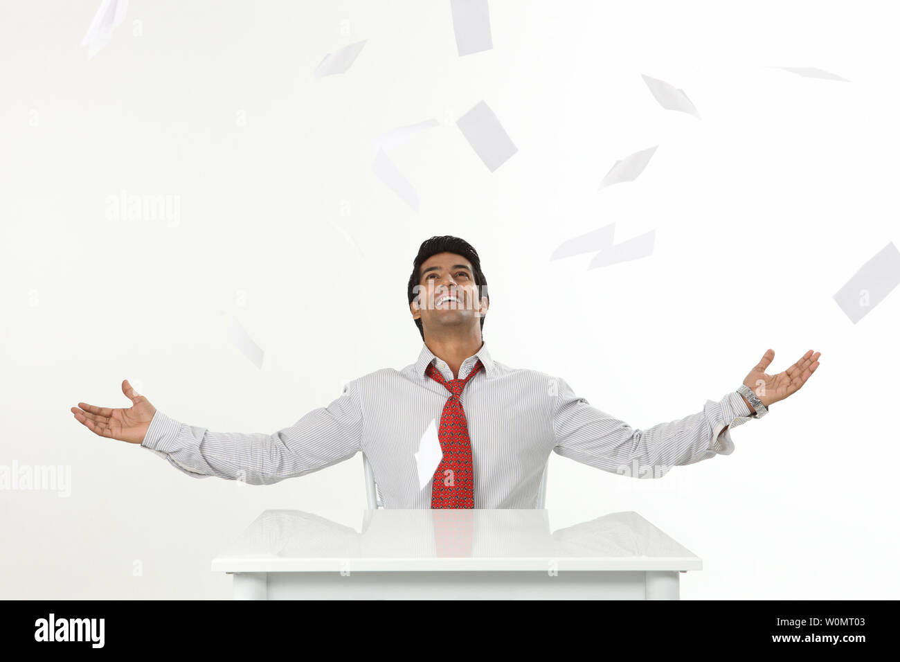 Indian businessman throwing papers hi-res stock photography and images ...