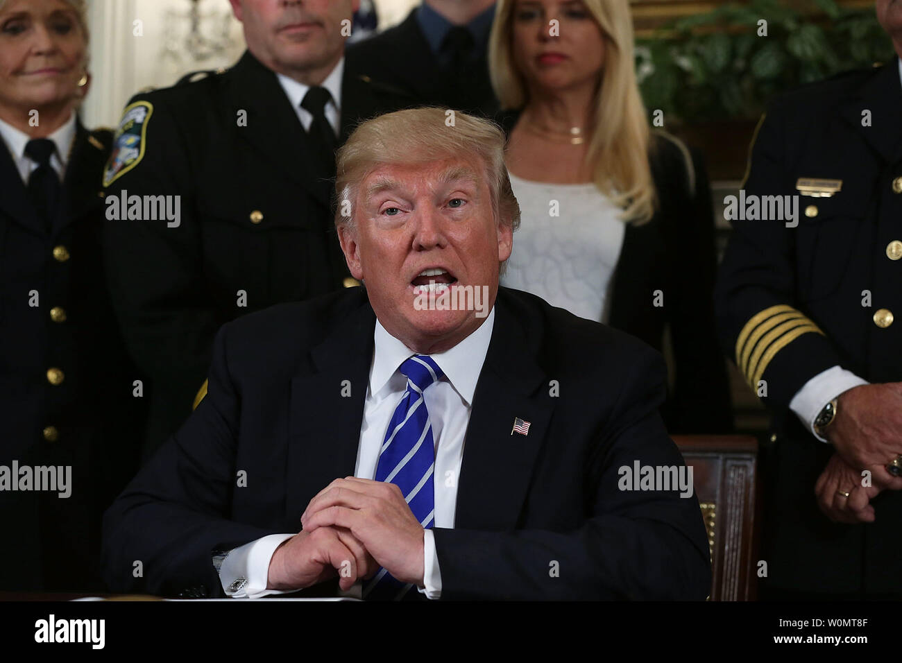U.S. President Donald Trump speaks during a bill signing in the ...
