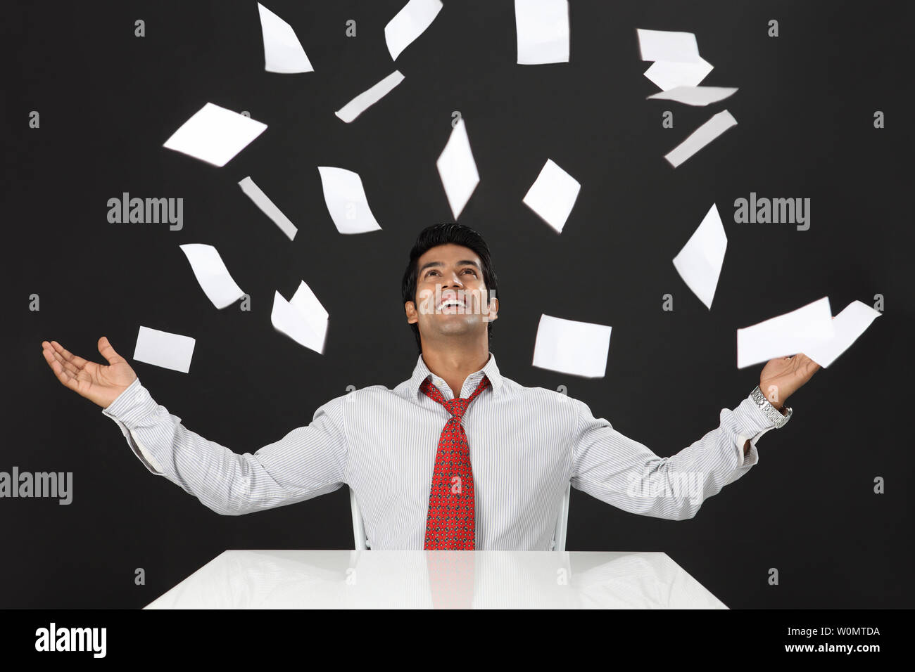 Indian businessman throwing papers hi-res stock photography and images ...