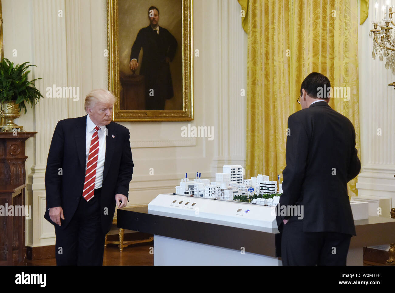 AT&T Senior Executive Randall Stephenson (R) explains to President ...
