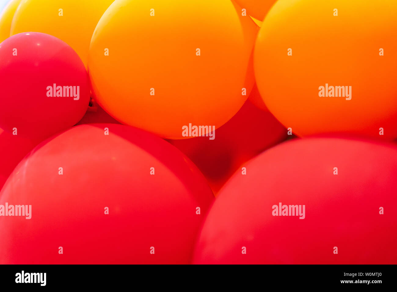 A lot of colored balloons come together Stock Photo - Alamy