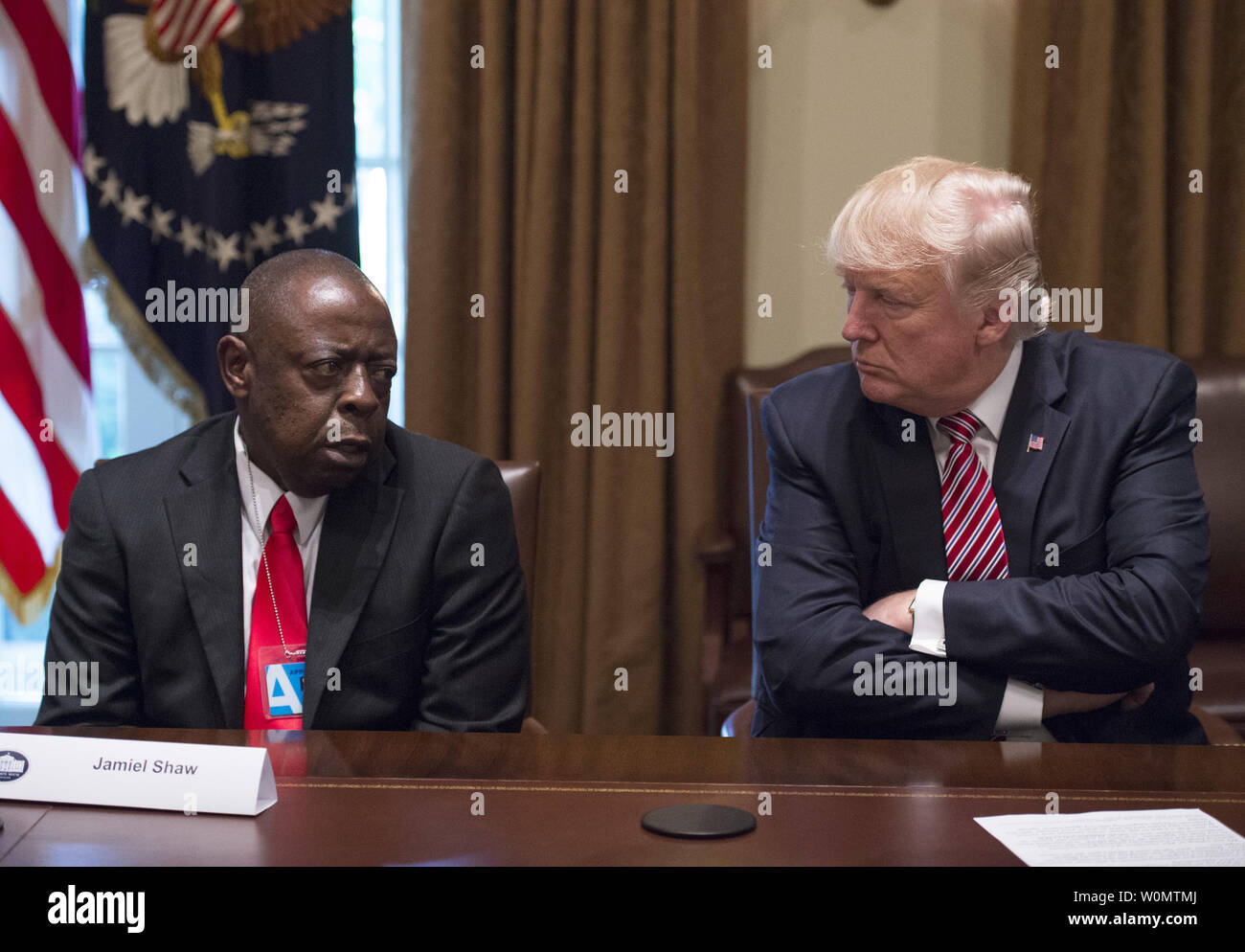 President Donald Trump listens to Jamiel Shaw, whose son Jamiel Shaw Jr ...