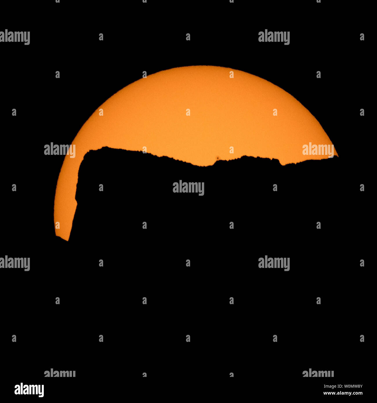 The NASA image taken on August 21, 2017 shows the Sun rising behind ...