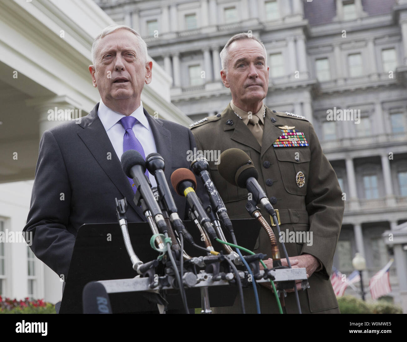 U.S. Secretary of Defense James Mattis (left) makes a statement on a ...
