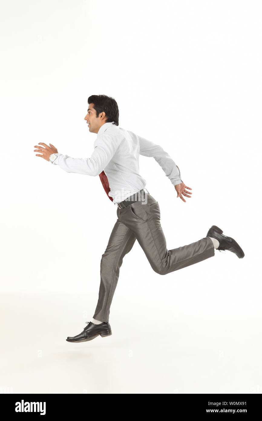 Indian businessman running hi-res stock photography and images - Alamy