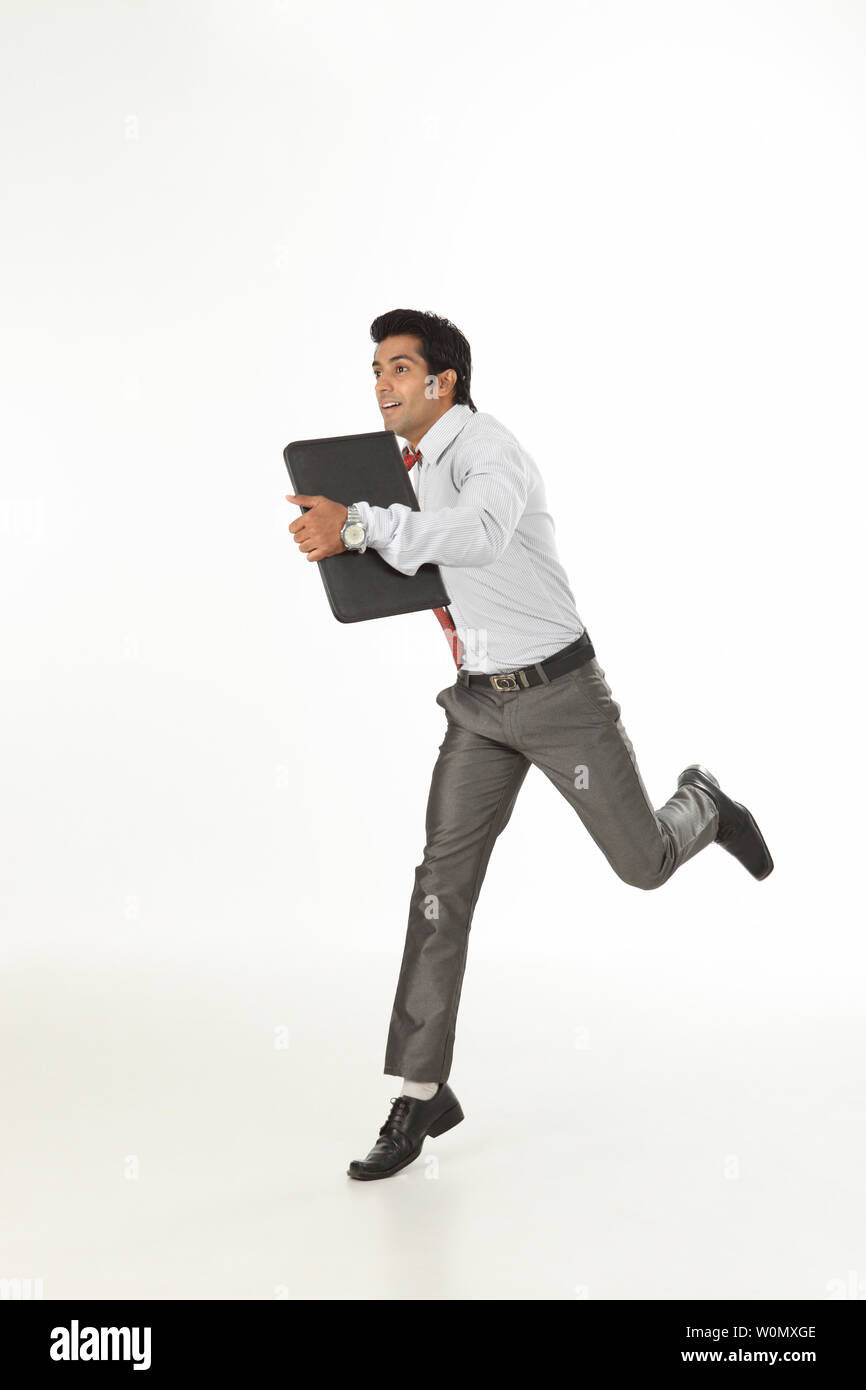 Indian businessman running file hi-res stock photography and images - Alamy