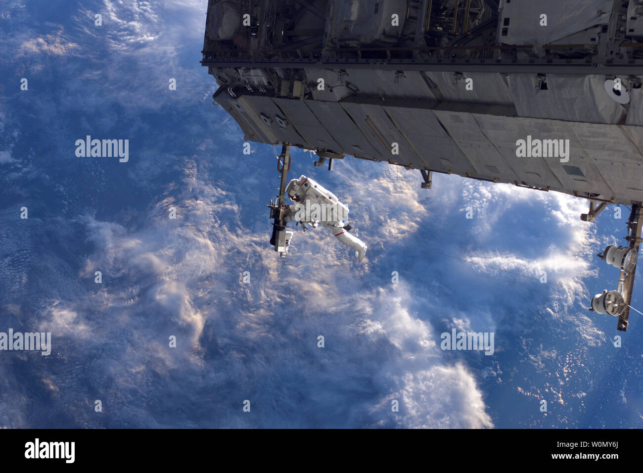 NASA astronaut Robert Curbeam works on the International Space Station ...