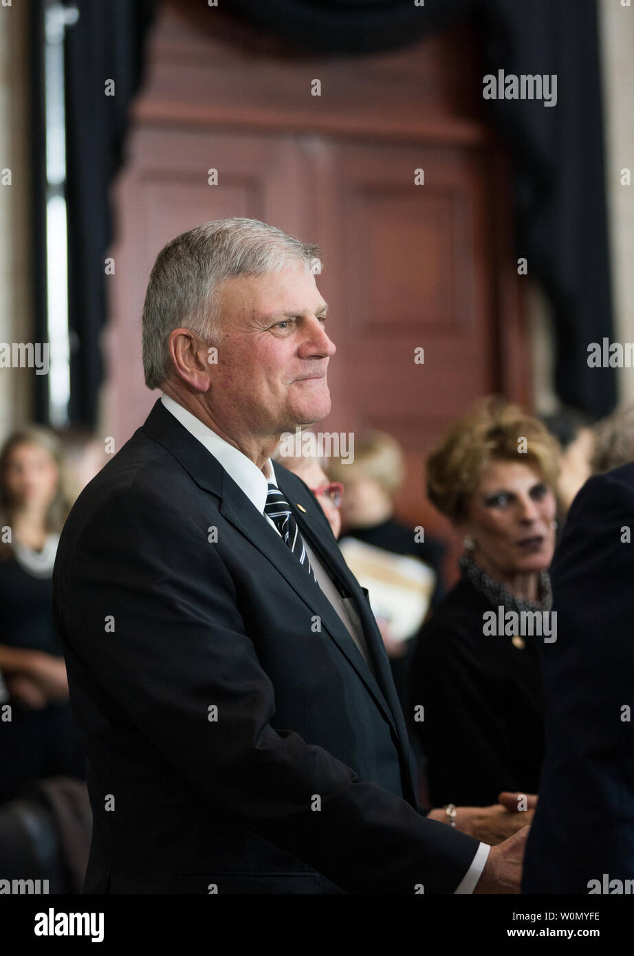 Franklin Graham, the son of Reverend Billy Graham, greets guests as the ...