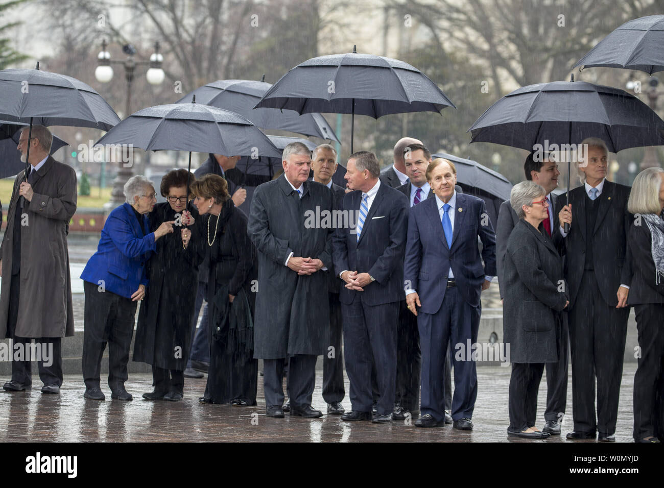 Family and guests watch the casket of American evangelist Billy Graham ...