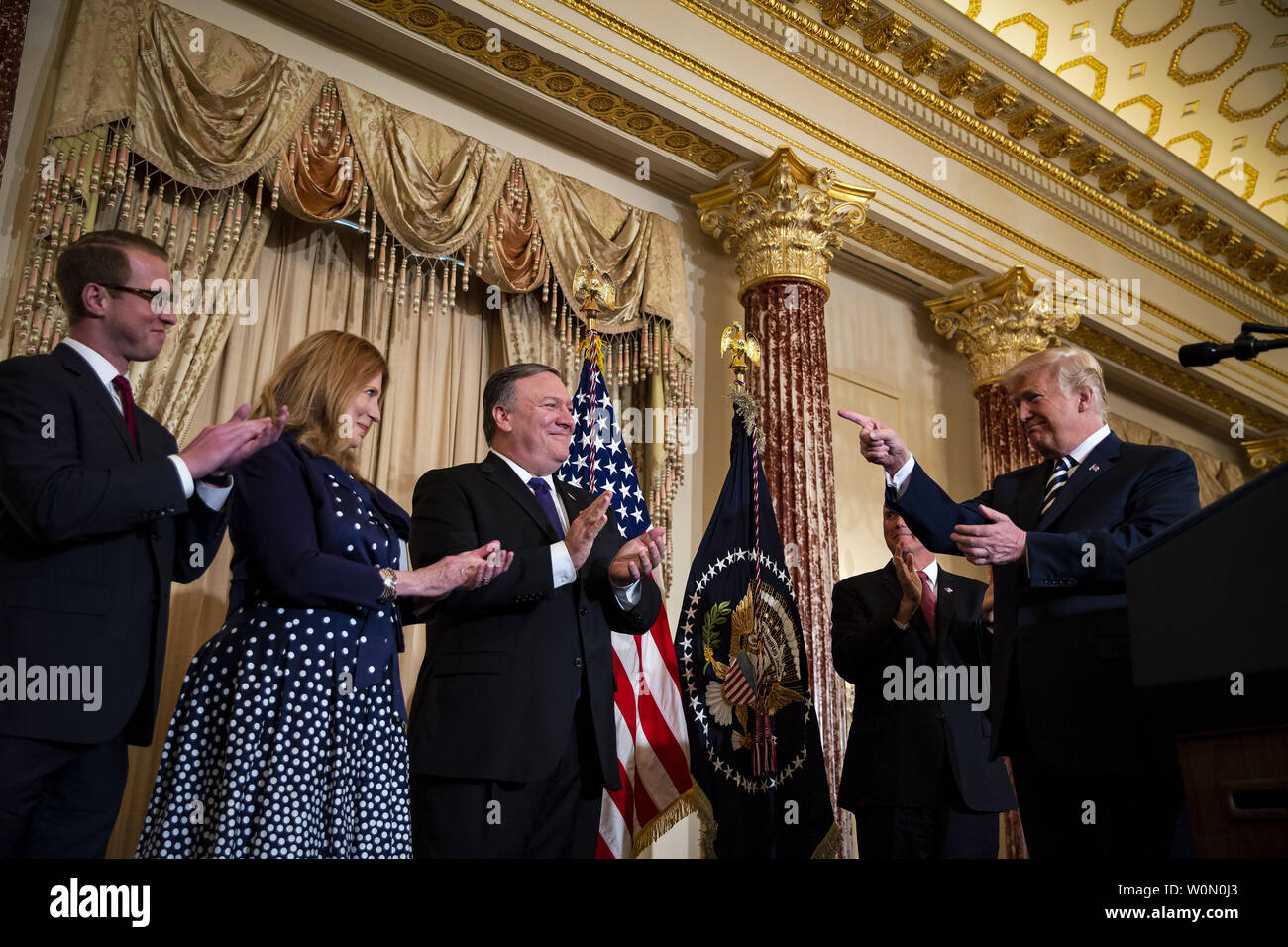 U.S. President Donald Trump gestures to Mike Pompeo, U.S. secretary of ...