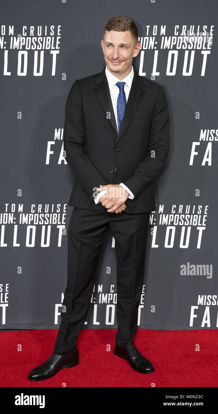 Frederick Schmidt arrives on the red carpet at the 'Mission: Impossible ...