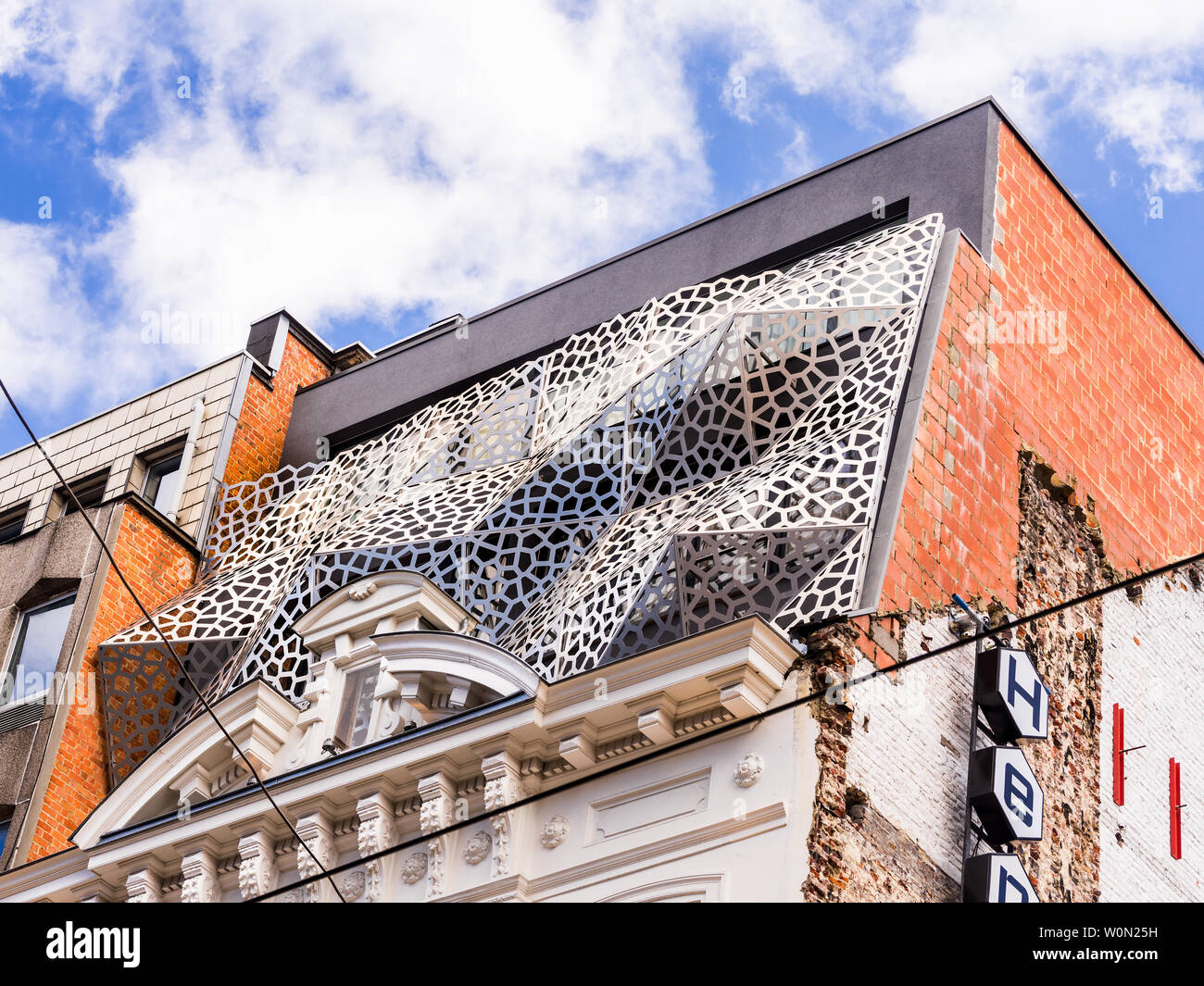 Modern sound insulating screen across old building facade - Saint ...
