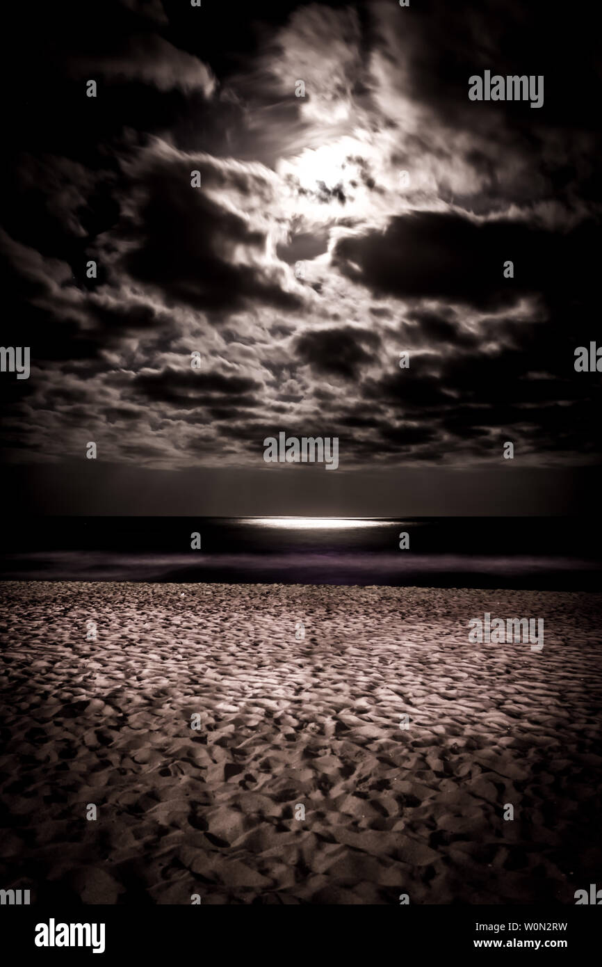 Mysterious night image of a mediterranean white sand beach in dark ...