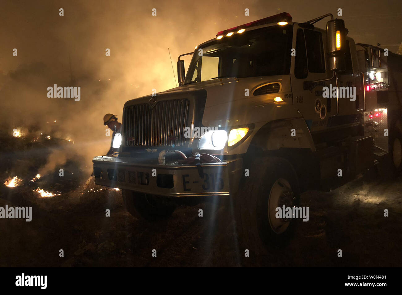 Members of a Santa Barbara County (SBC) 5-engine, along with a ...