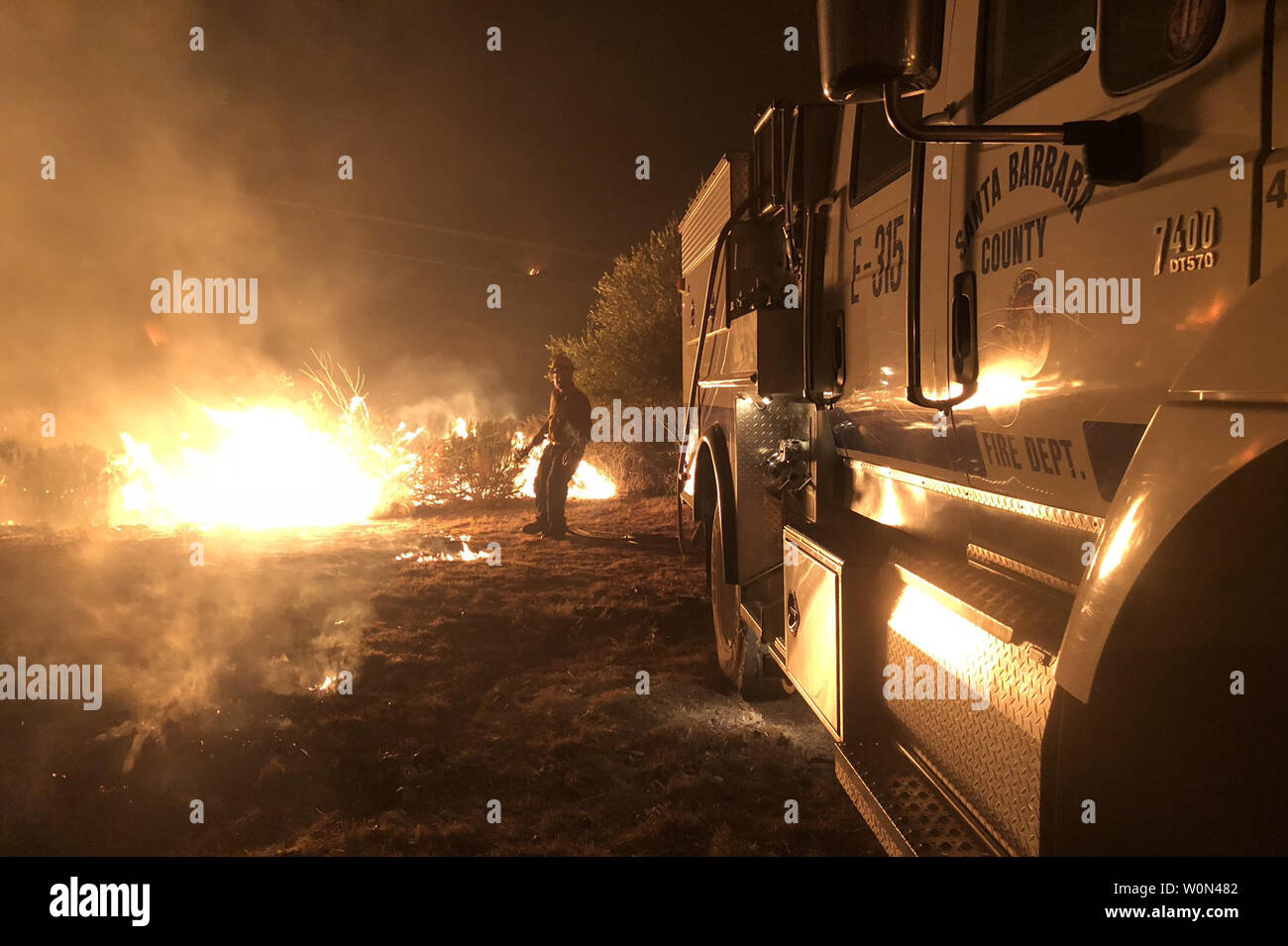 Members of a Santa Barbara County (SBC) 5-engine, along with a ...