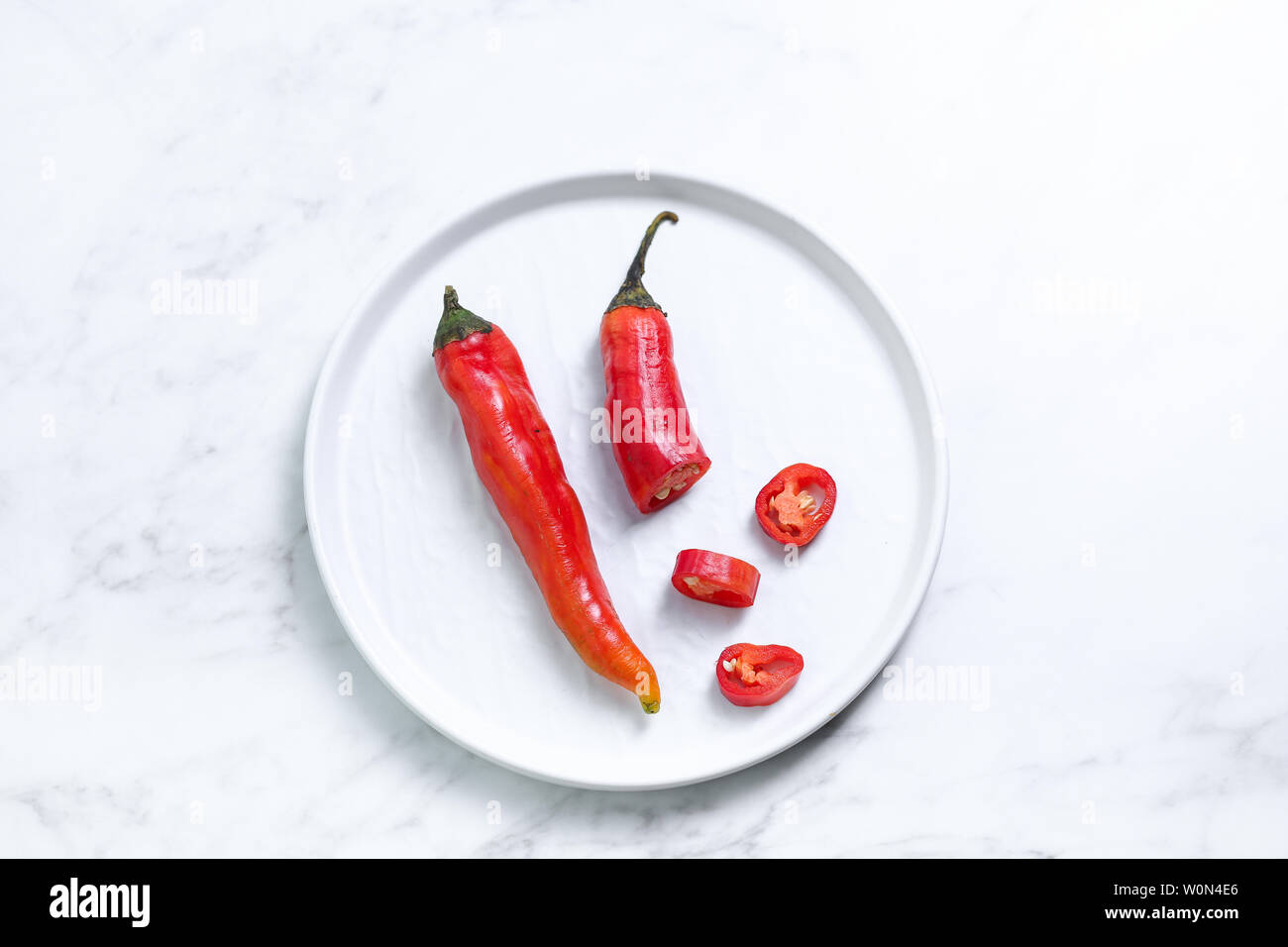 The chili peppers on the plate Stock Photo - Alamy