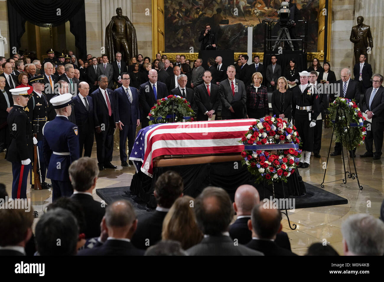 Members of President Donald Trump's cabinet stop to pay their respect ...