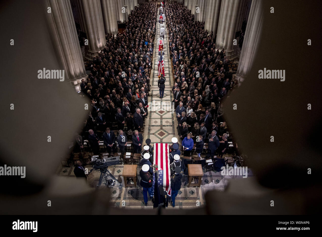 The flag-draped casket of former President George H.W. Bush is arrives ...