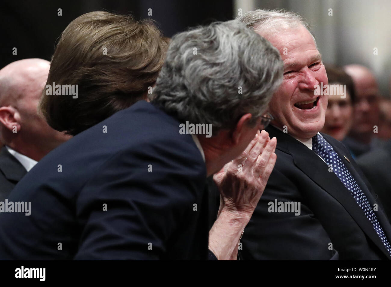 Former President George W. Bush smiles with his brother Jeb Bush at the ...