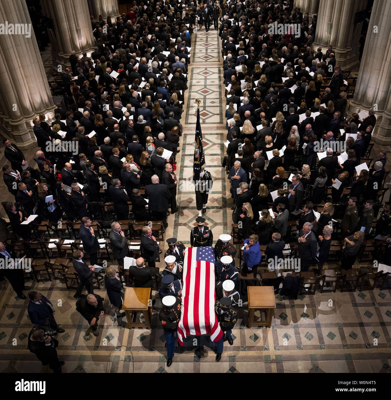 The Honor Guard carries the casket of former president George Herbert ...