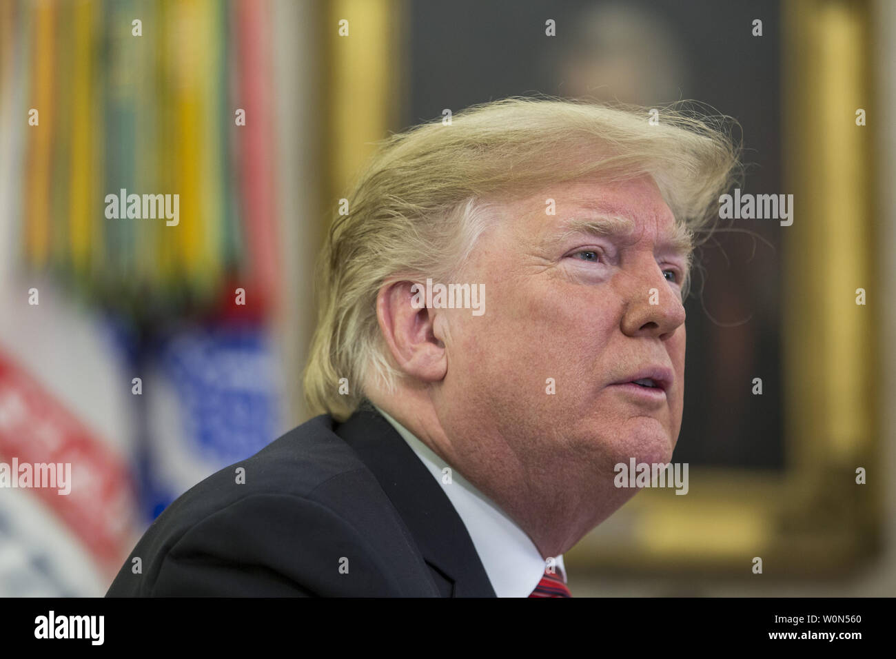 President Donald Trump answers questions from members of the press ...