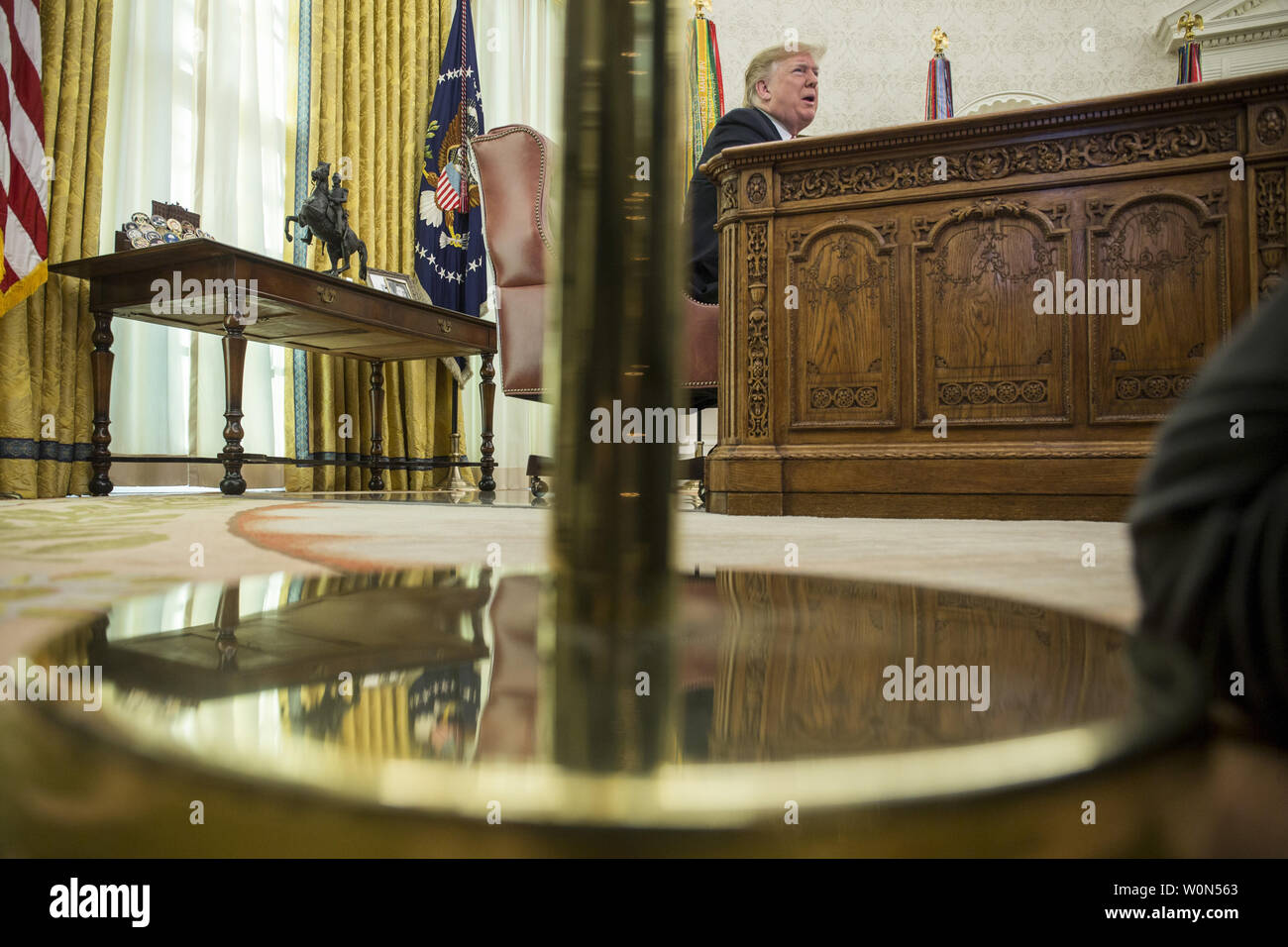 President Donald Trump answers questions from members of the press ...