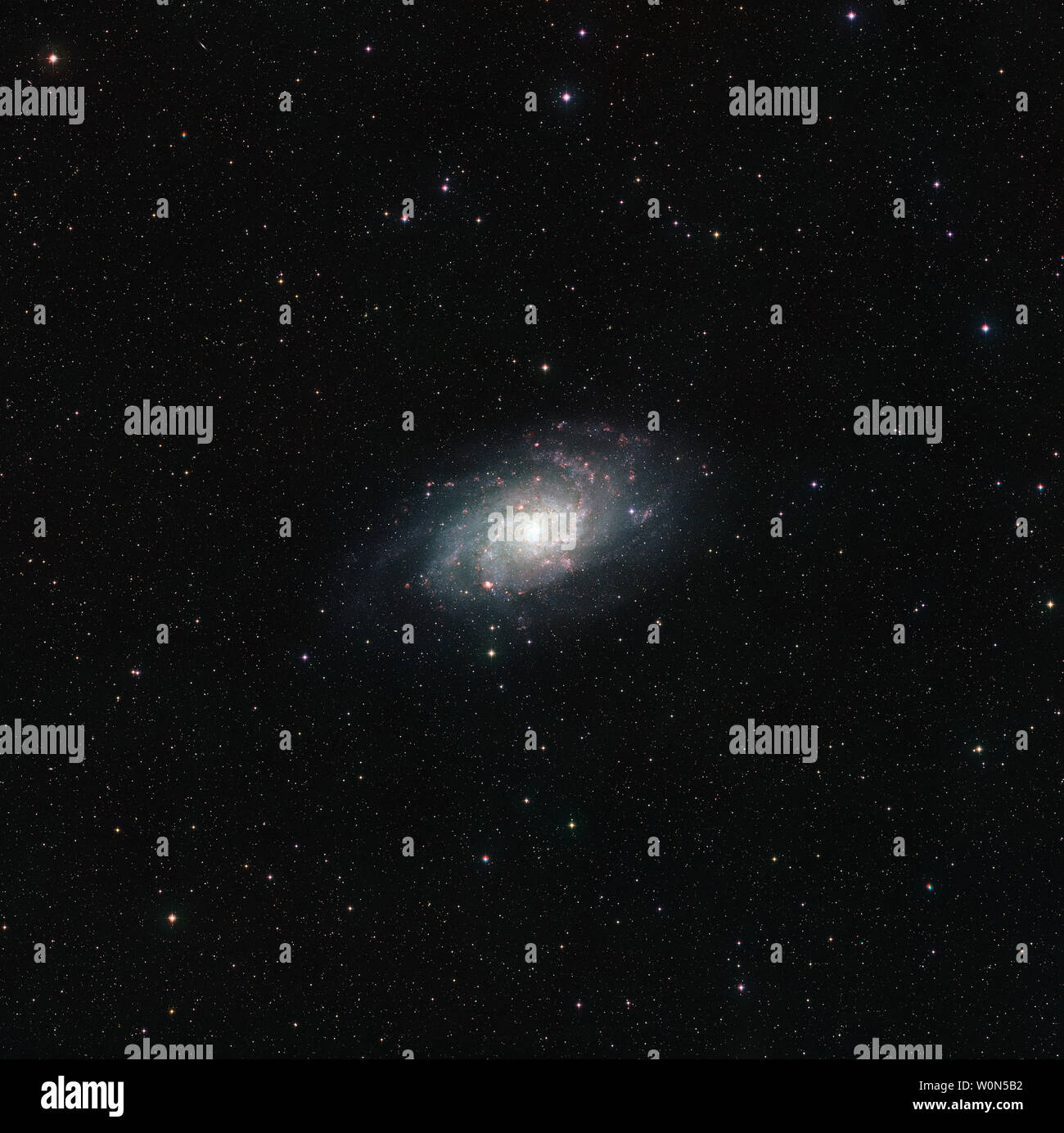 This wide-field view of the sky around the nearby galaxy Messier 33 was ...