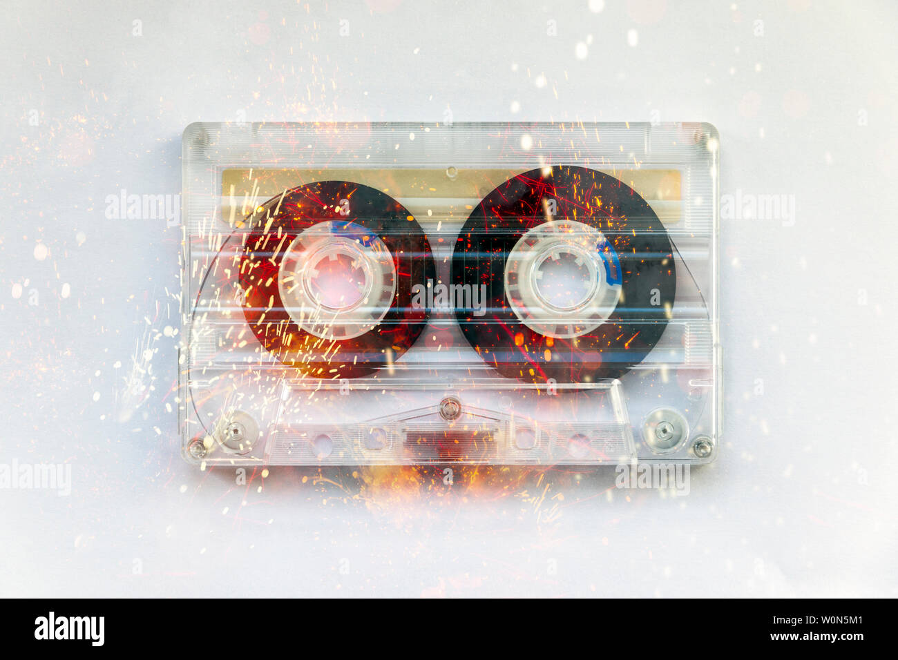 Concept image of a transparent plastic compact cassette audio tape ...