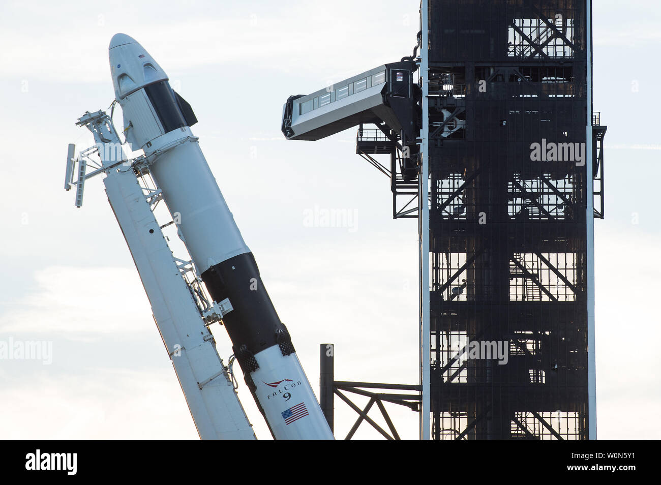 A SpaceX Falcon 9 rocket with the company's Crew Dragon spacecraft ...