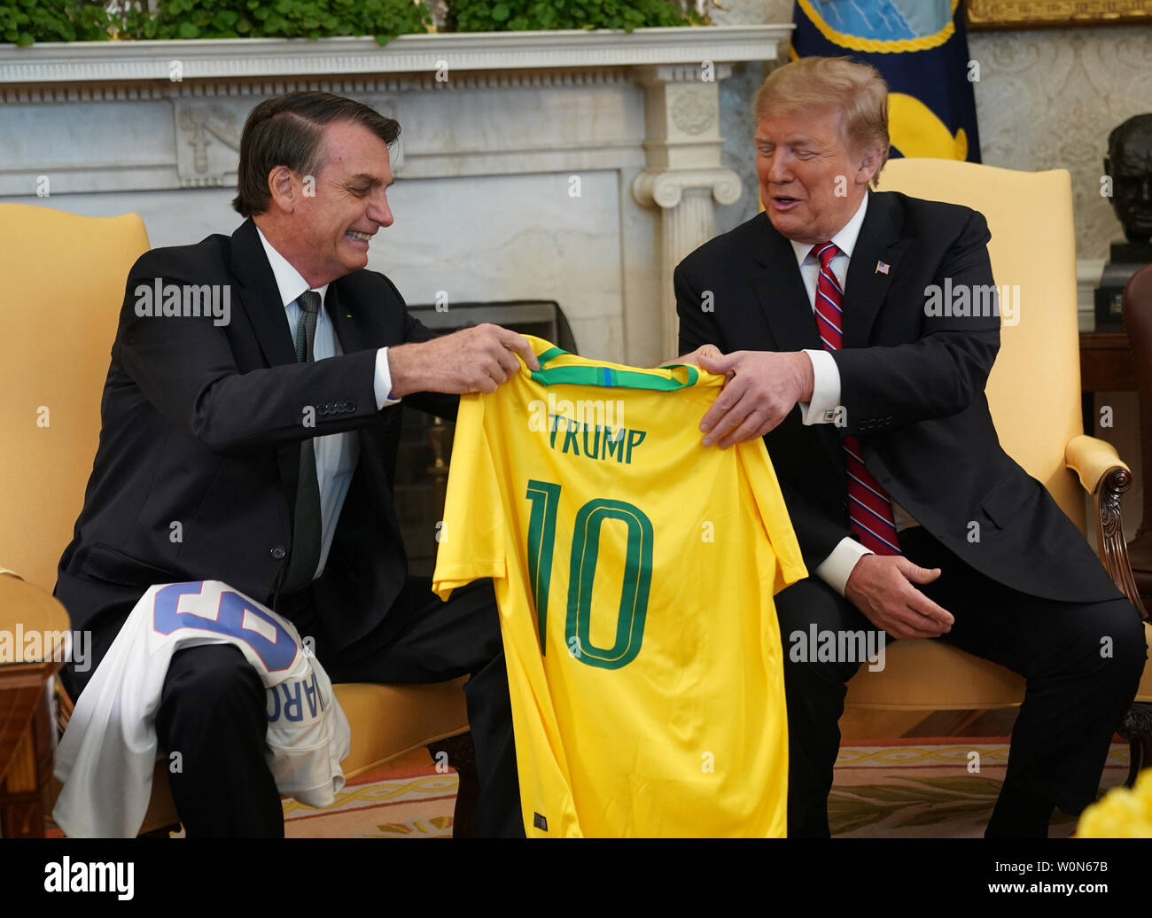 President Donald Trump receives a Brazilian national soccer team jersey ...