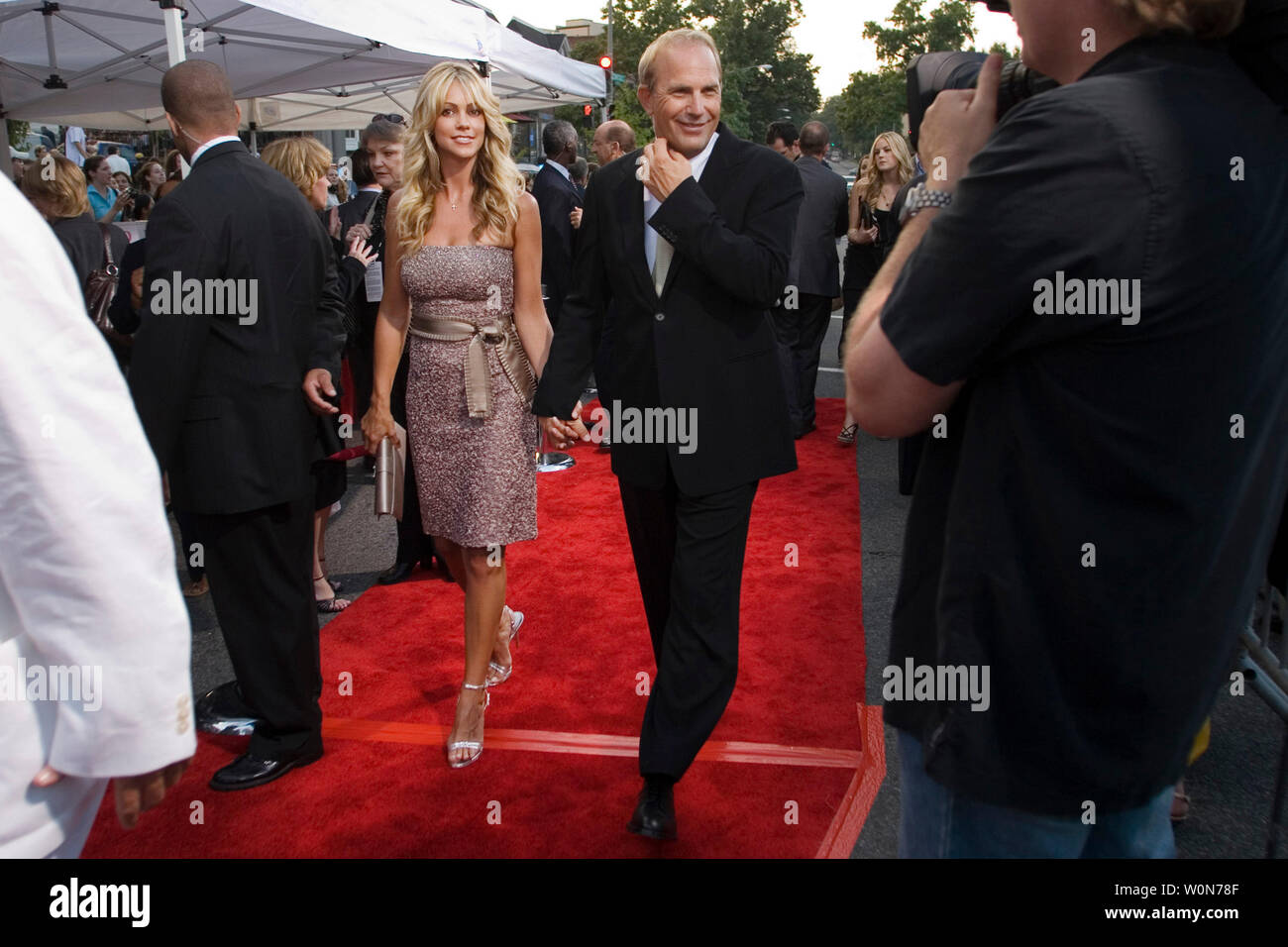 Kevin Costner and wife Christine Baumgartner attend the world premiere ...