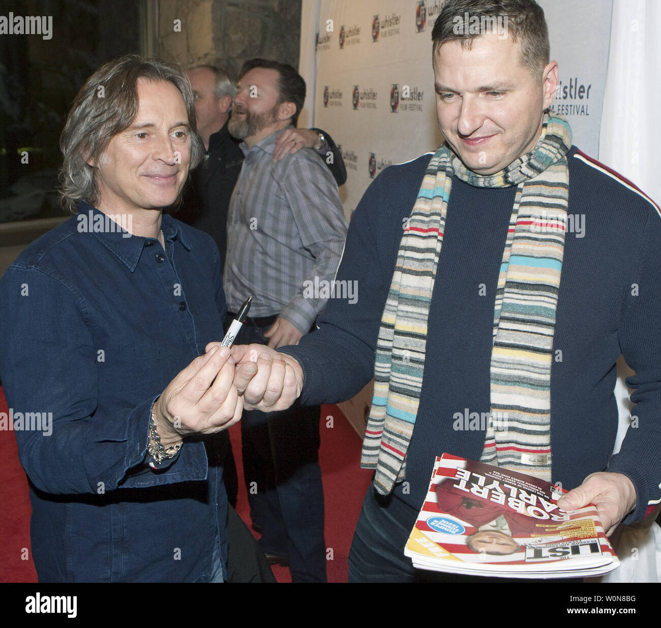 Scottish actor and director Robert Carlyle signs autographs on the red ...