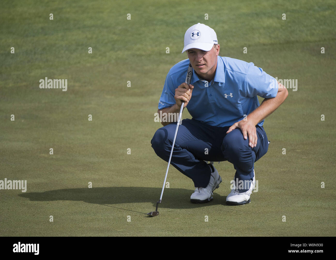 Jordan Spieth lines up a putt on the 12th green during round 1 of the ...