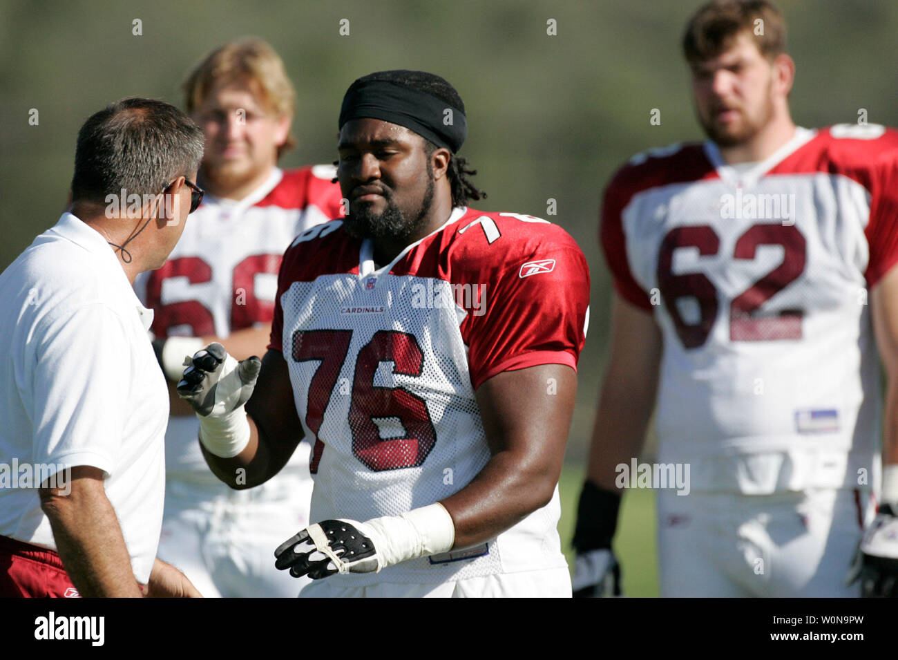 (l-r) Arizona Cardinals Offensive Coordinator Keith Rowan instructs ...
