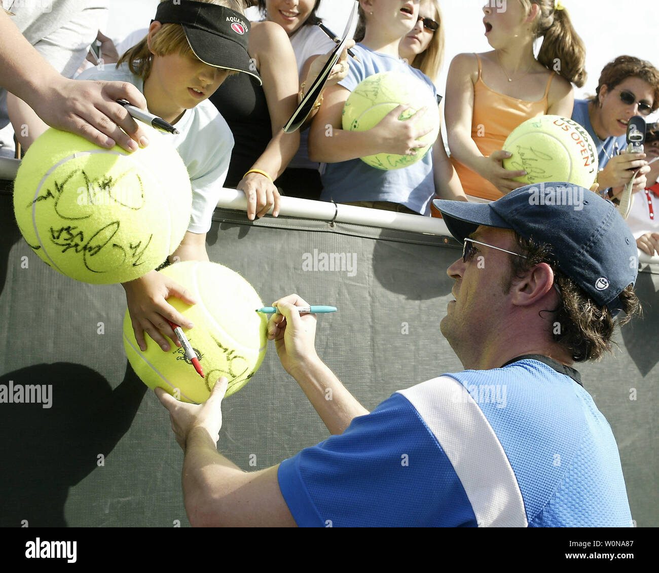 Actor Matthew Perry signs autographs after his play in the Chris Evert ...