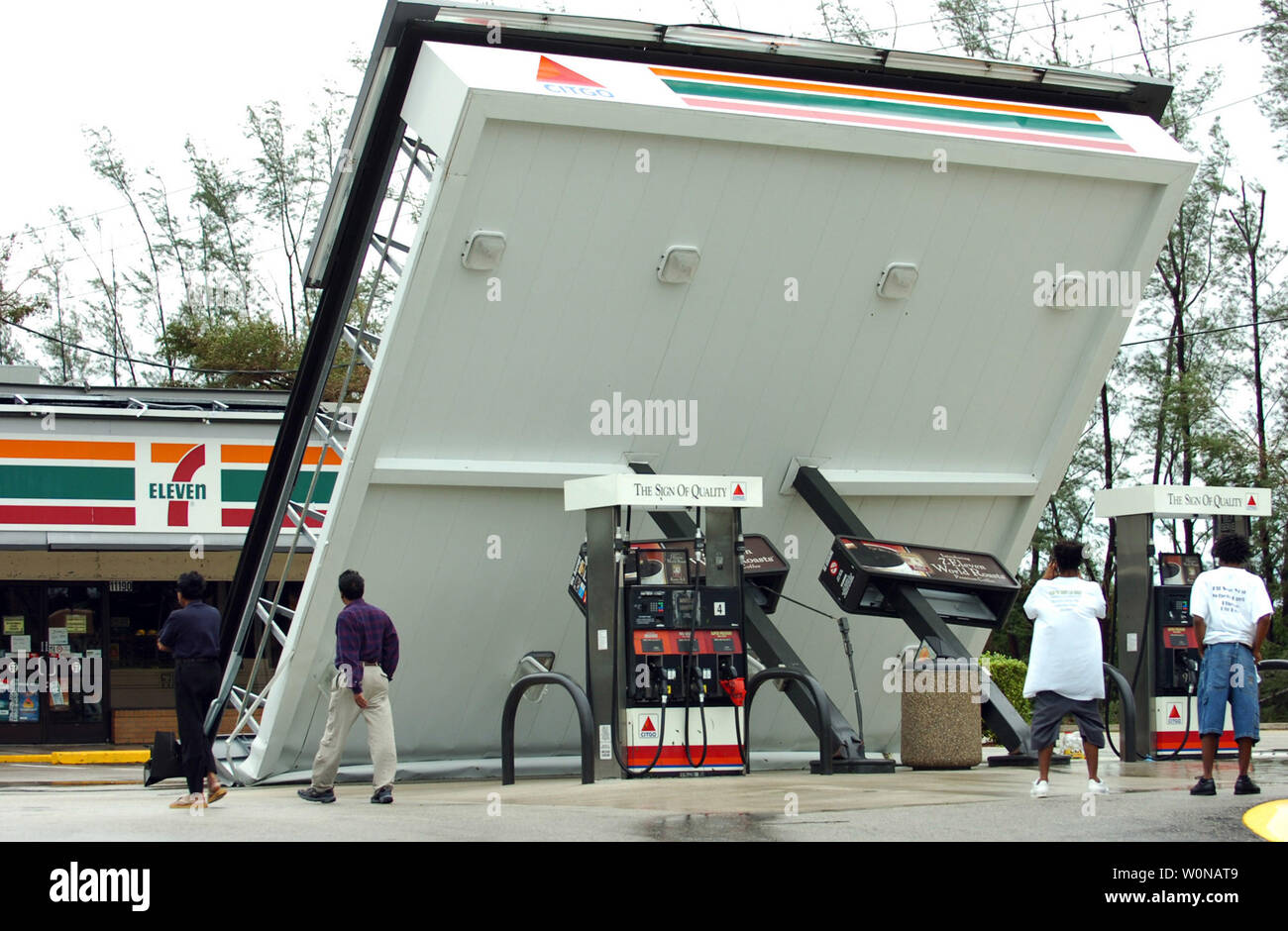 Residents walked over to view the storm damage at a Seven Eleven that ...