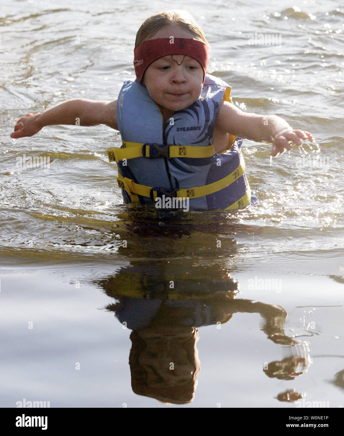 Seven-year-old Ean Patterson departs the water after participating in ...
