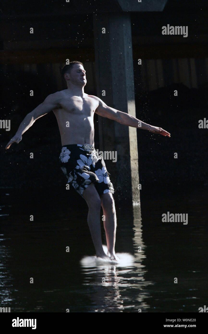 A participant is about to hit the water in the 27th annual Polar Bear ...