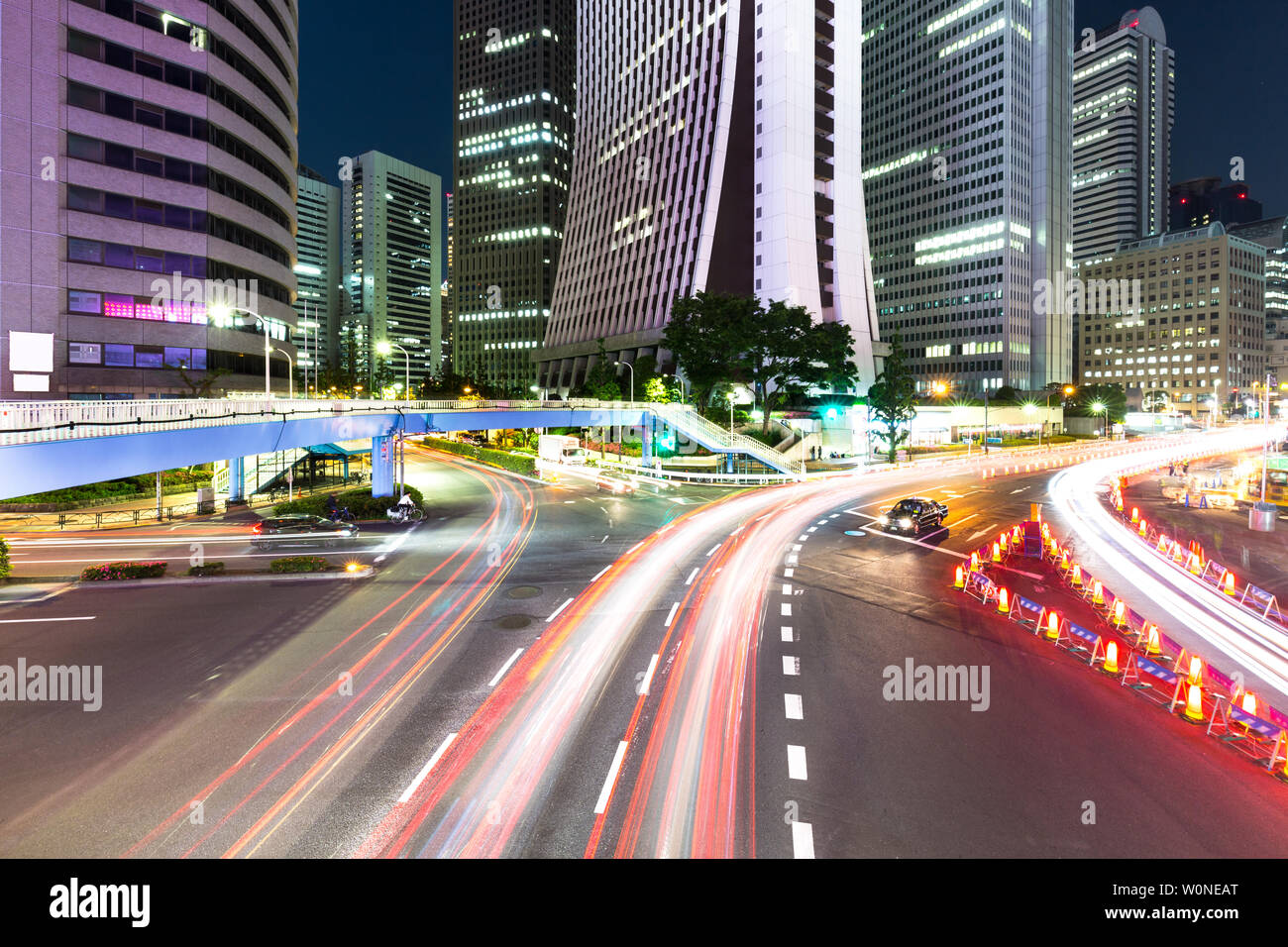 traffic on road in downtown of tokyo at night Stock Photo - Alamy