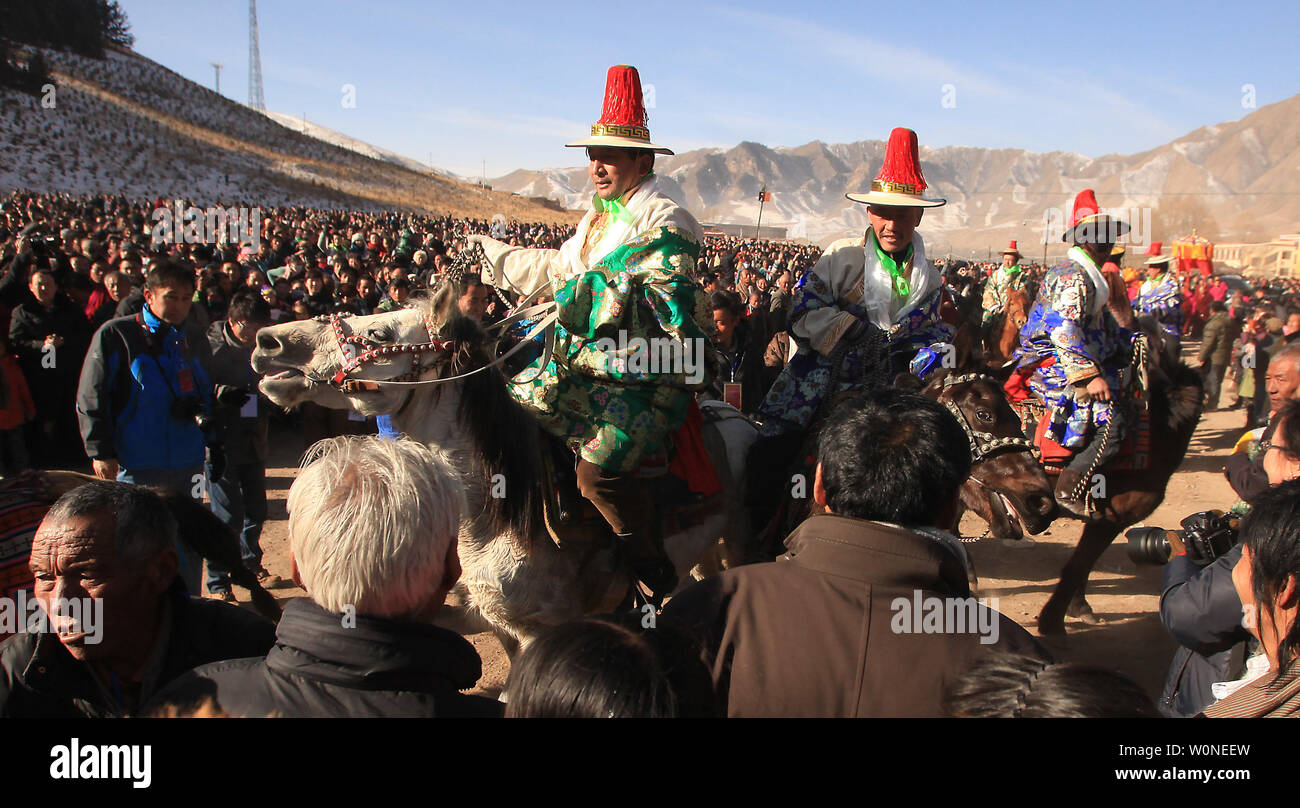 Tibetan horesmen perform crowd control duties during the unveiling of a ...