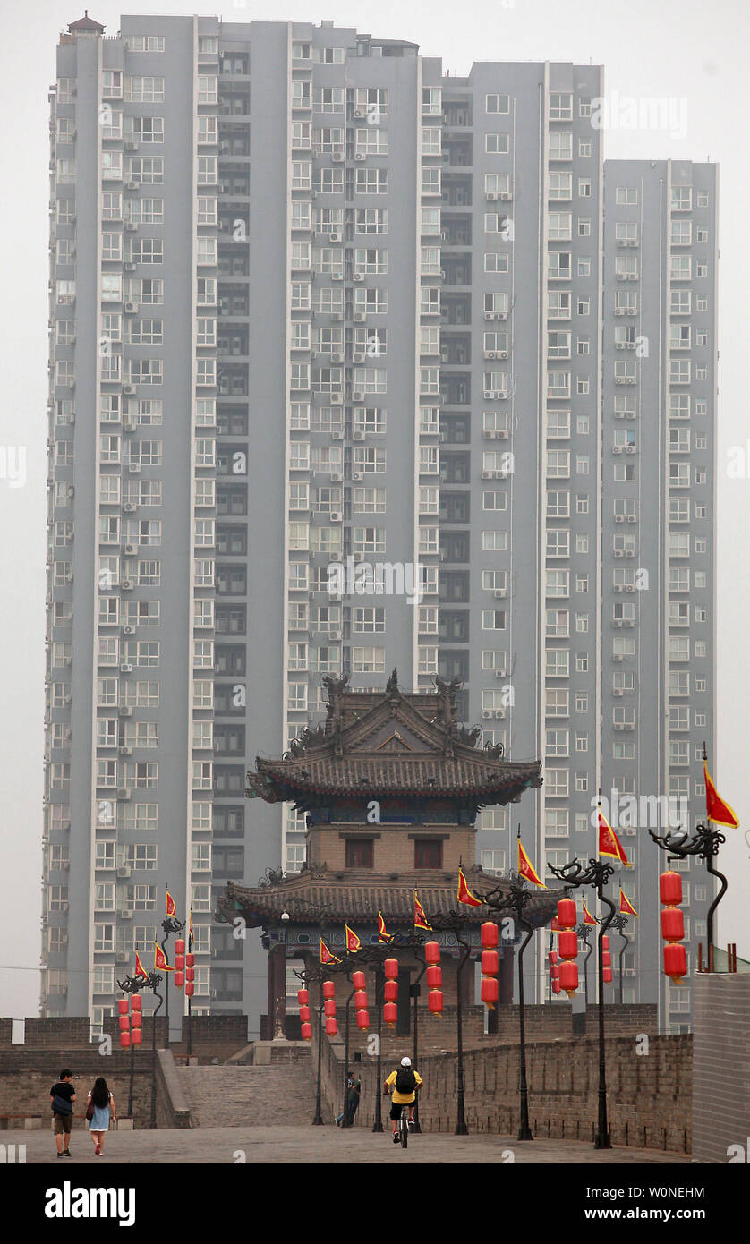 Modern residential and commercial buildings dominate the skyline next ...