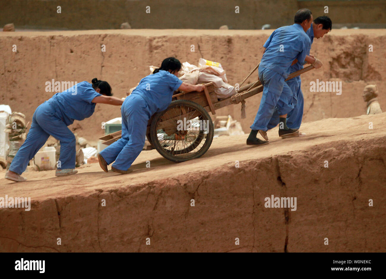 Chinese work on a dig site housing a portion of the over 8,000 ...