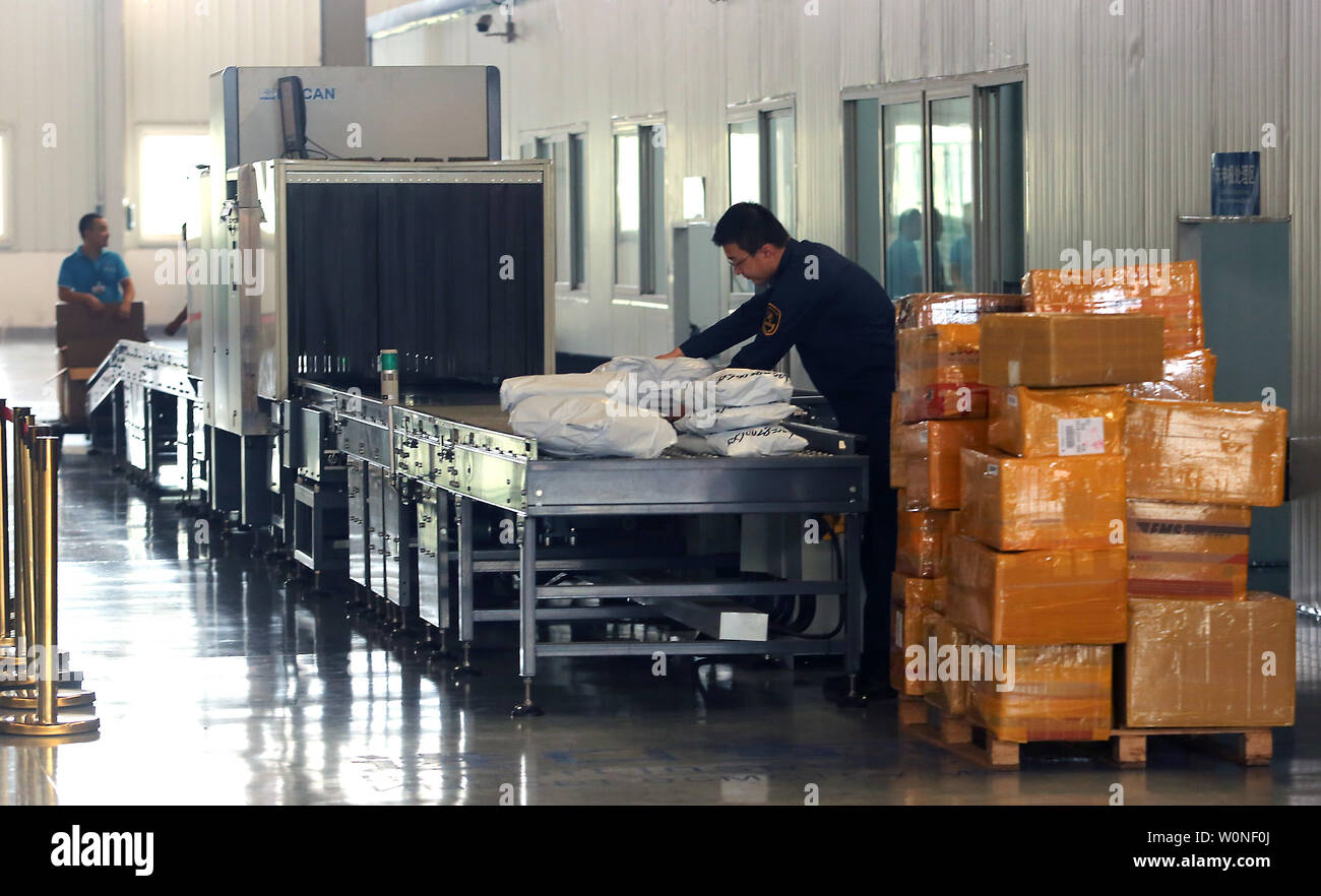 Foreign correspondents get a behind the scenes look at packages being ...